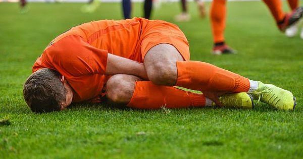 Footballer banned five years for biting opponent below belt