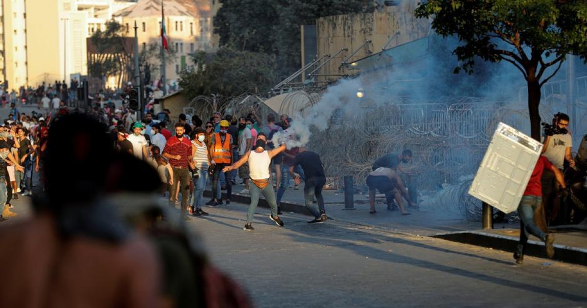 Beirut police fire tear gas as protesters regroup and two ministers quit