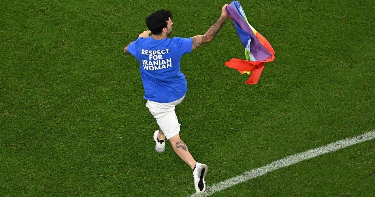 Man with rainbow flag invades pitch during World Cup match