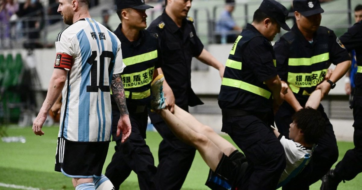 Chinese pitch invader detained after hugging Messi