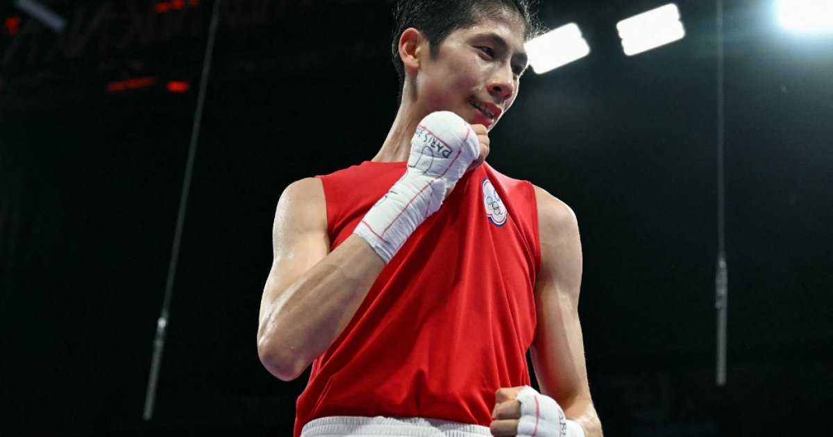 Taiwanese boxer in Olympics gender row wins to guarantee medal