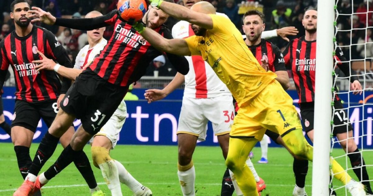 Milan scrape a point with Genoa after late penalty howler