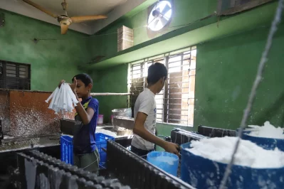 In pictures: A busy candle factory in Dhaka