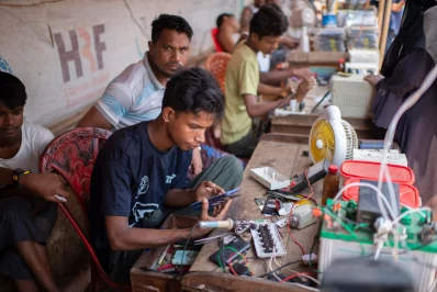 How do Rohingyas use mobile banking services in camps?