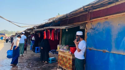 How do Rohingyas use mobile banking services in camps?