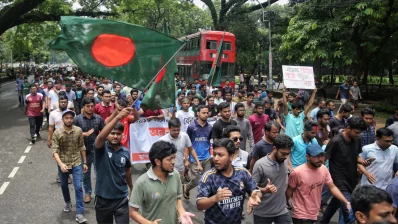 In pictures: Chants and banners against quota system fill Shahbagh
